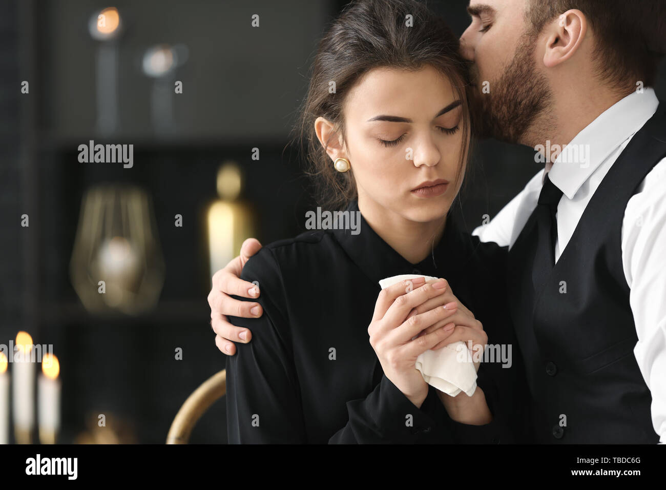 Couple pining after their relative at funeral Stock Photo - Alamy