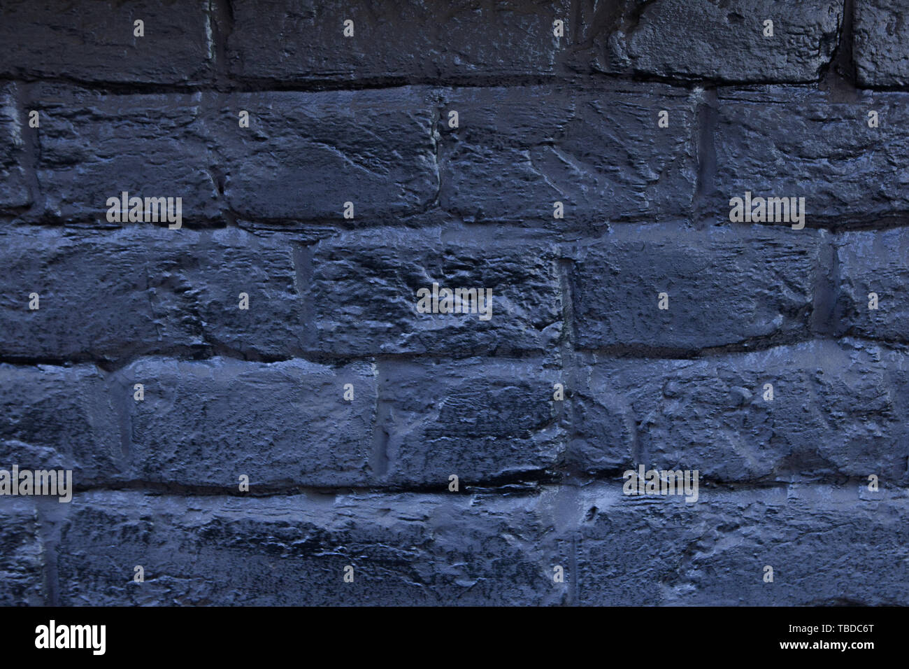 The brick wall painted in blue. Background of old vintage blue brick ...