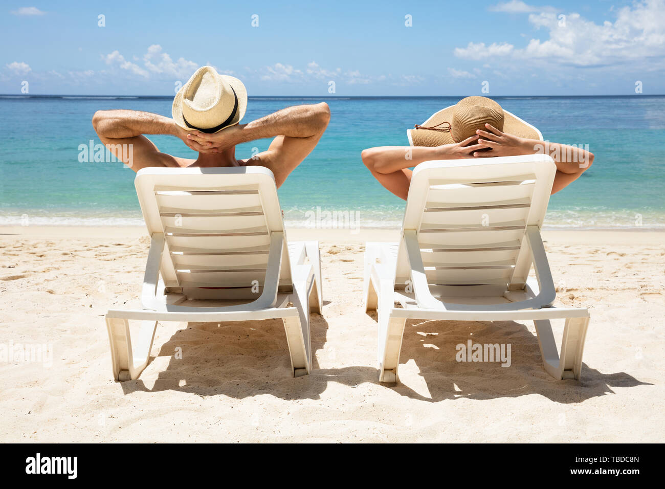 Woman beach chair behind hi-res stock photography and images - Alamy