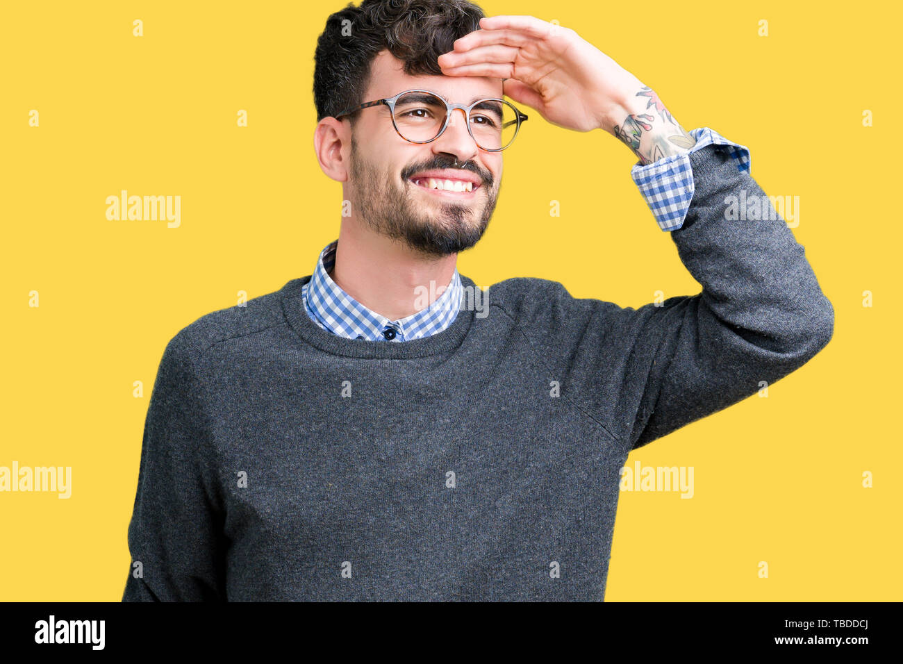 Young handsome smart man wearing glasses over isolated background very ...