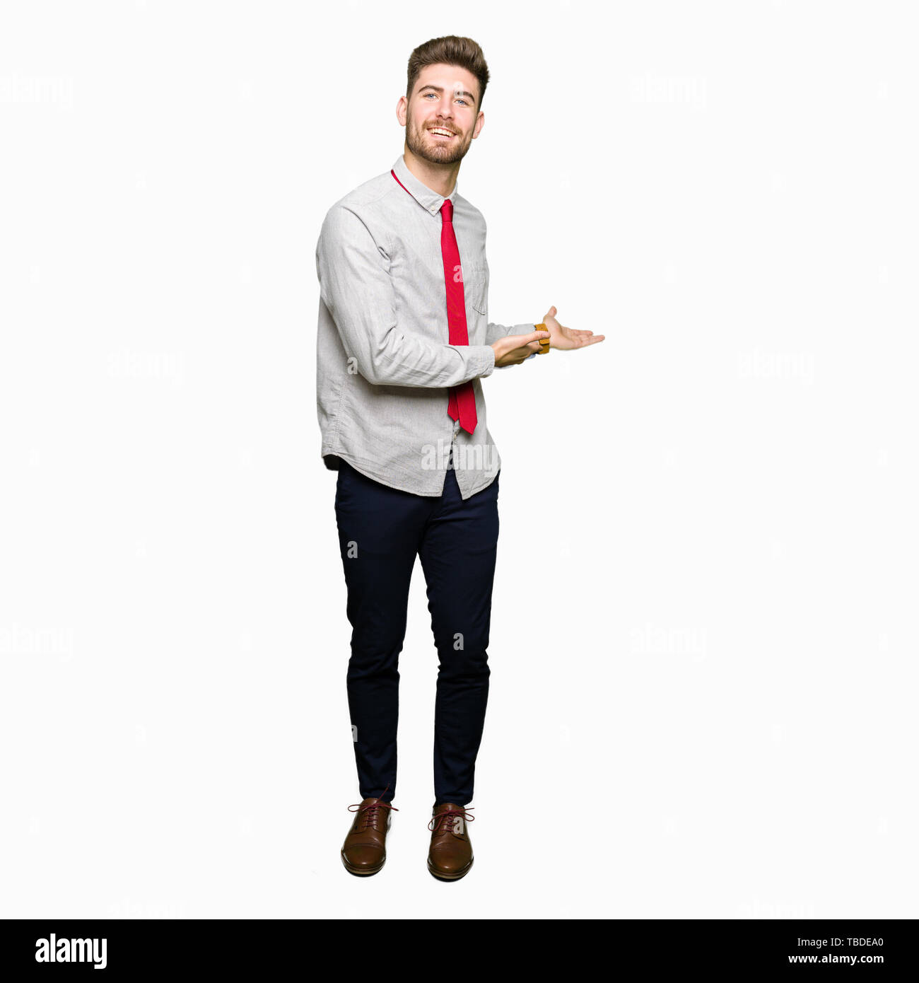 Young handsome business man Inviting to enter smiling natural with open ...
