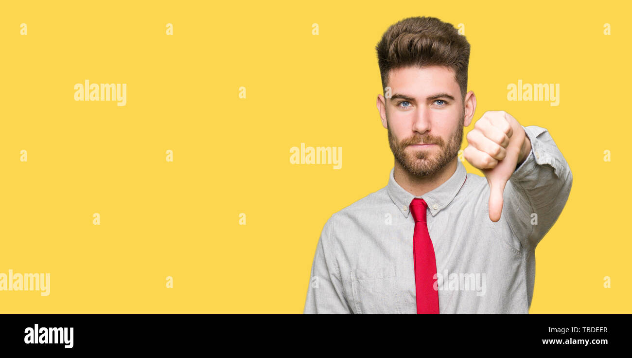 Young handsome business man looking unhappy and angry showing rejection ...
