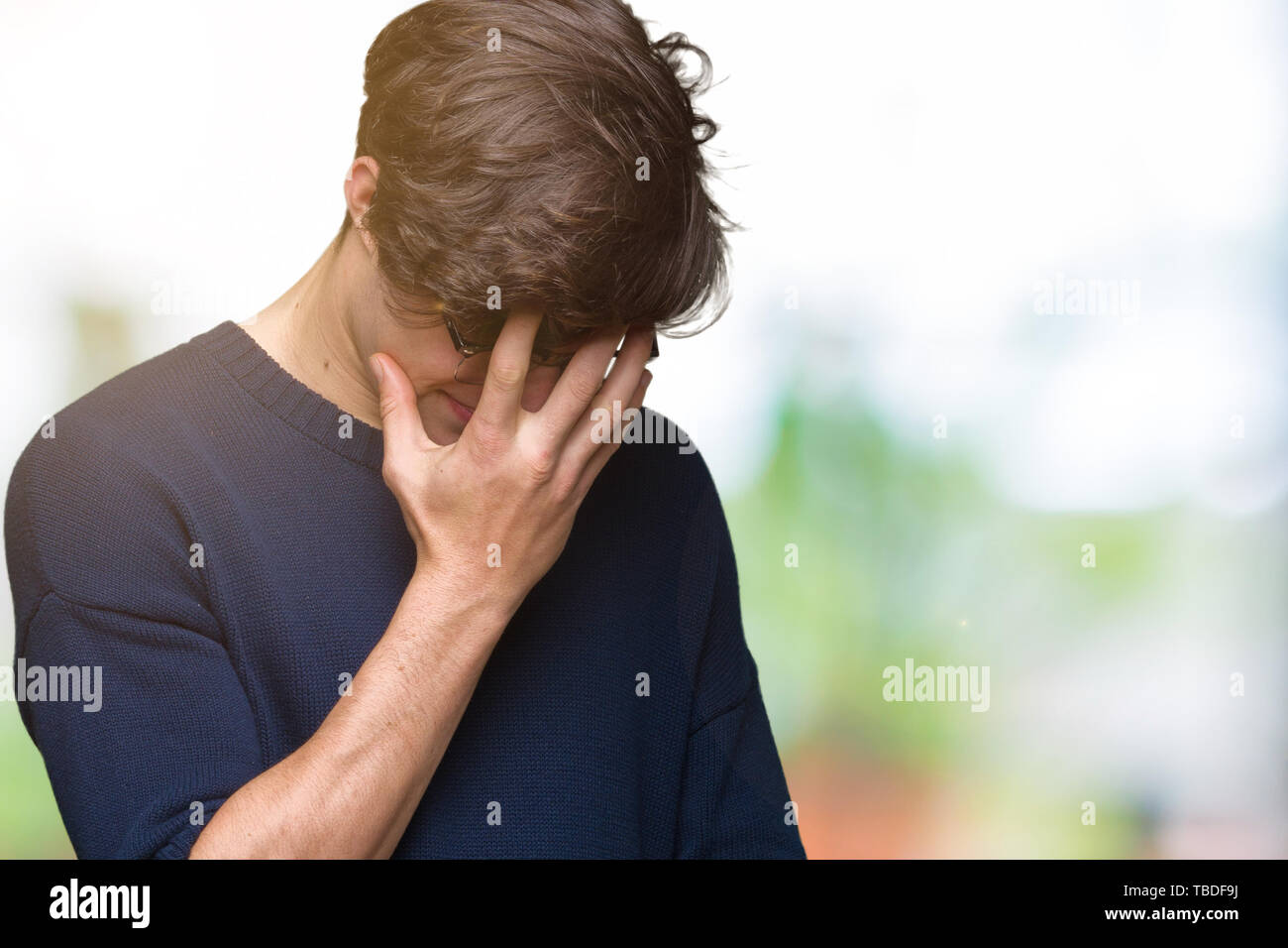 Young handsome man wearing glasses over isolated background with sad ...