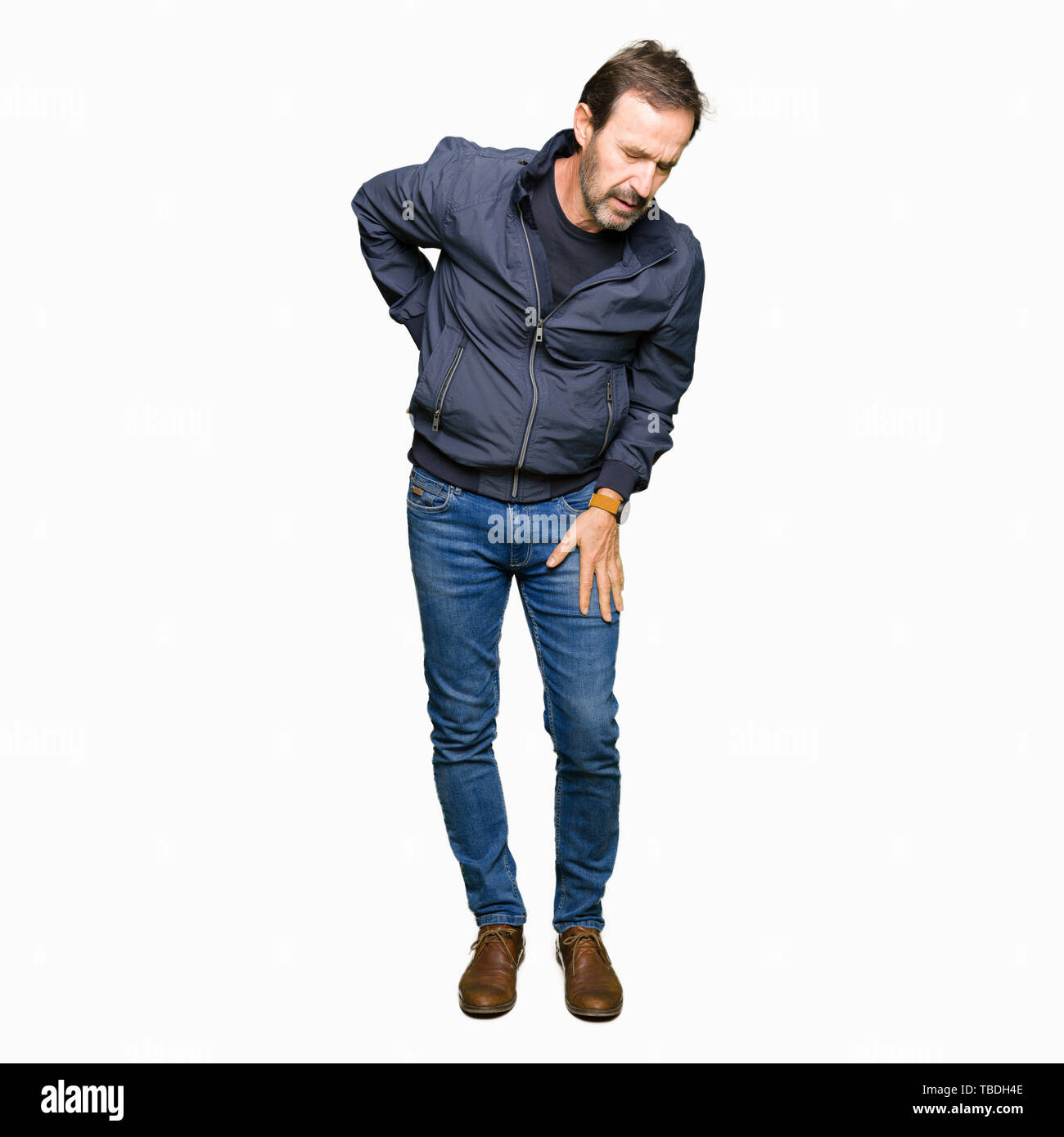 Middle age handsome man wearing a jacket Suffering of backache ...