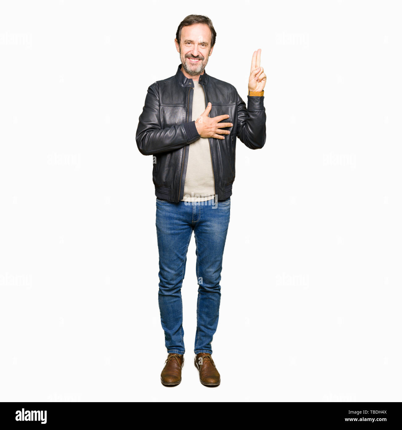 Middle age handsome man wearing black leather jacket Swearing with hand ...