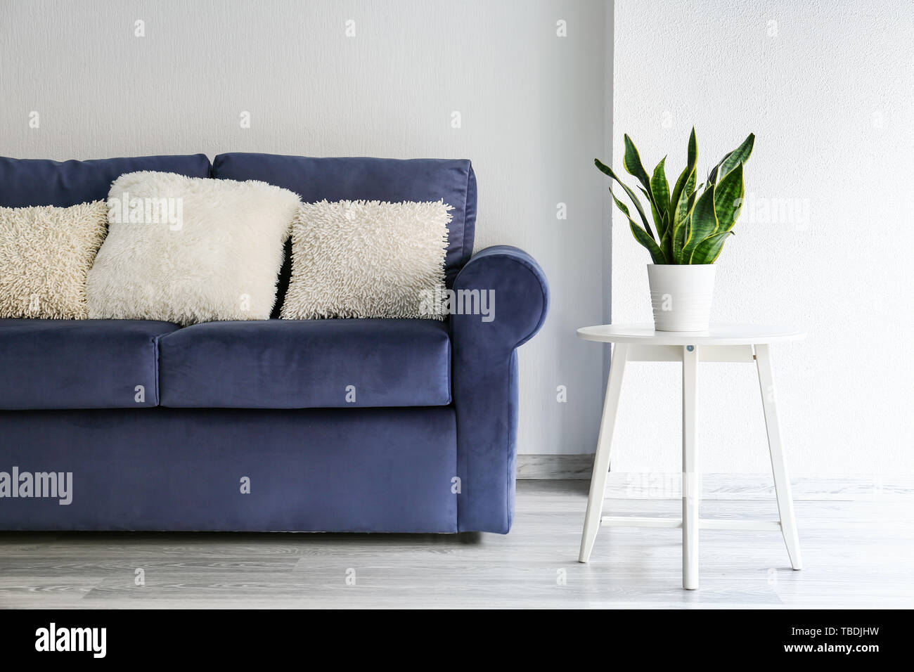Interior of modern room with comfortable sofa Stock Photo - Alamy
