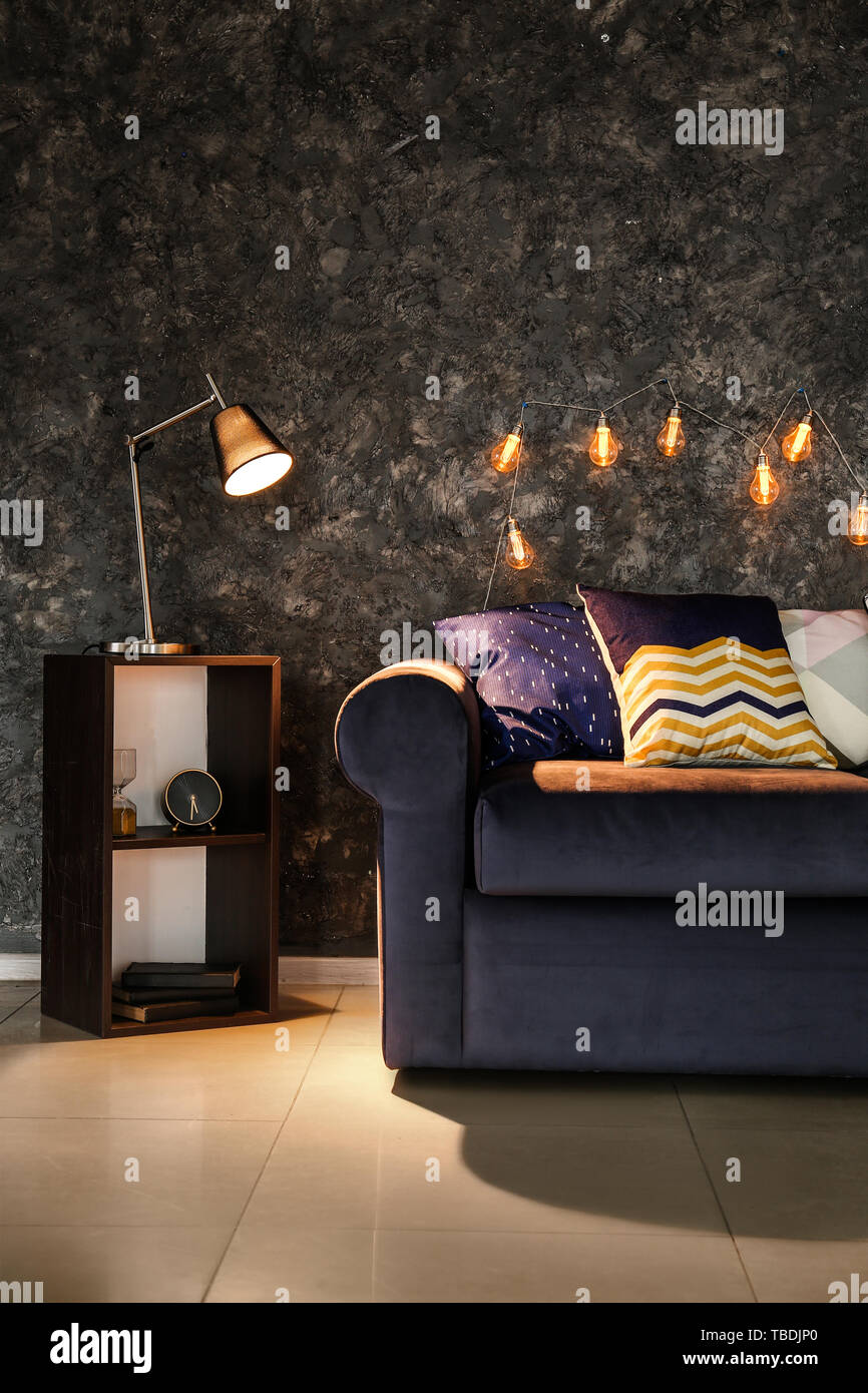 Interior of modern room with comfortable sofa Stock Photo - Alamy