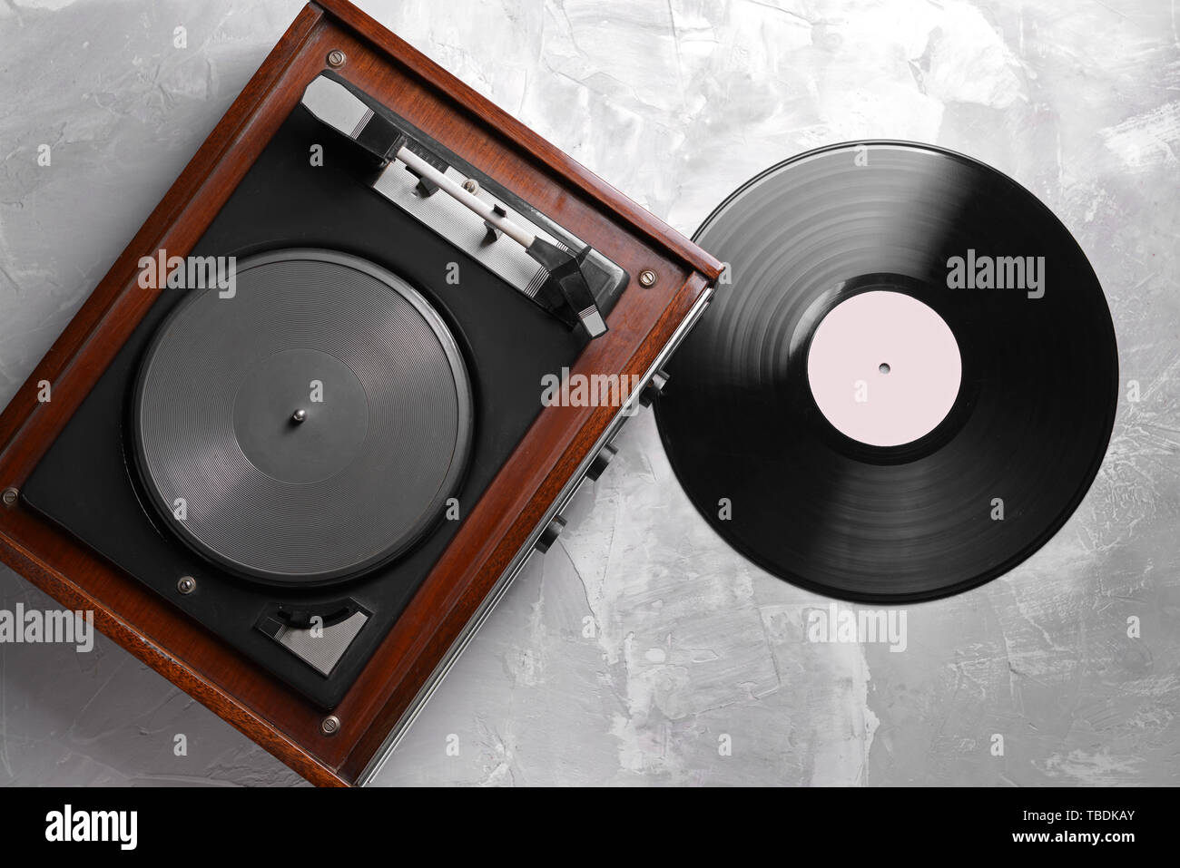 Record player with vinyl disc on grey background Stock Photo - Alamy