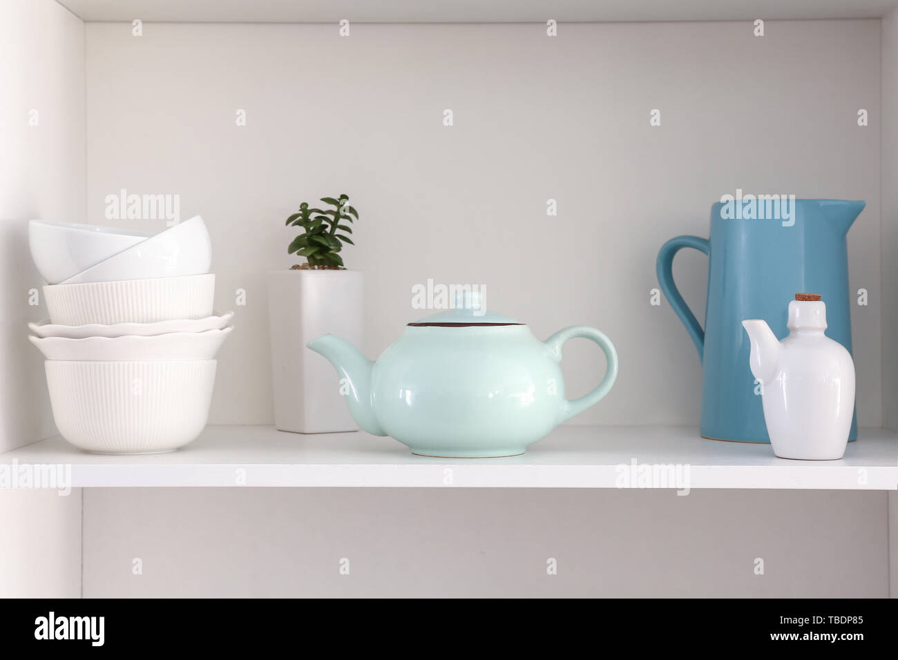 Shelf with clean dishes in kitchen Stock Photo - Alamy