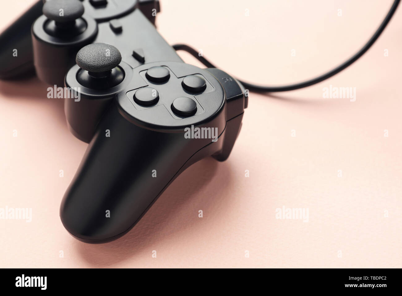 Modern game pad on color background Stock Photo - Alamy
