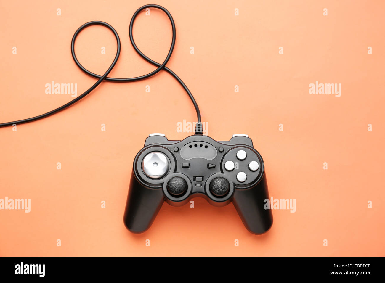Modern game pad on color background Stock Photo - Alamy