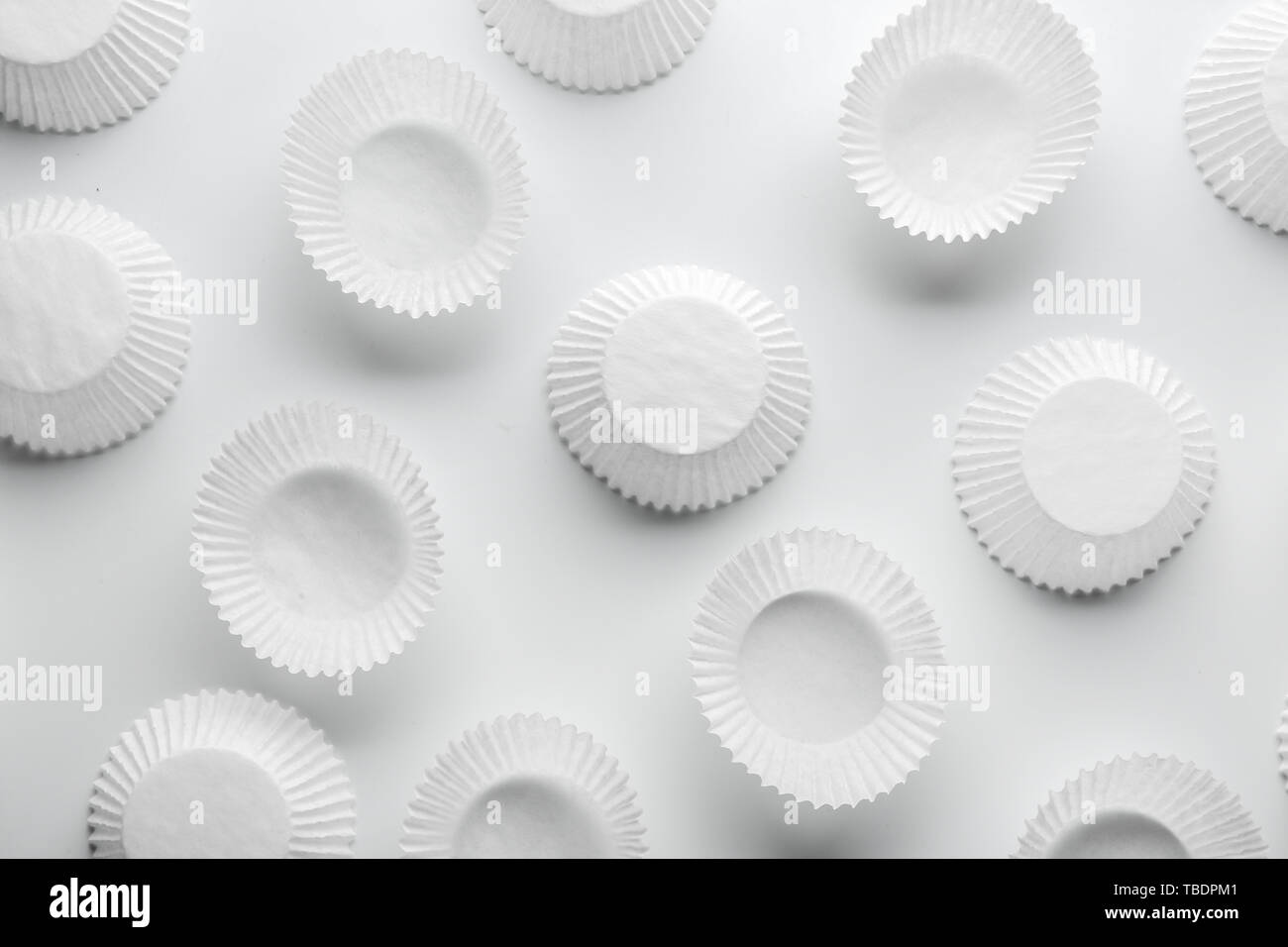 Paper cups for baking on white background Stock Photo - Alamy