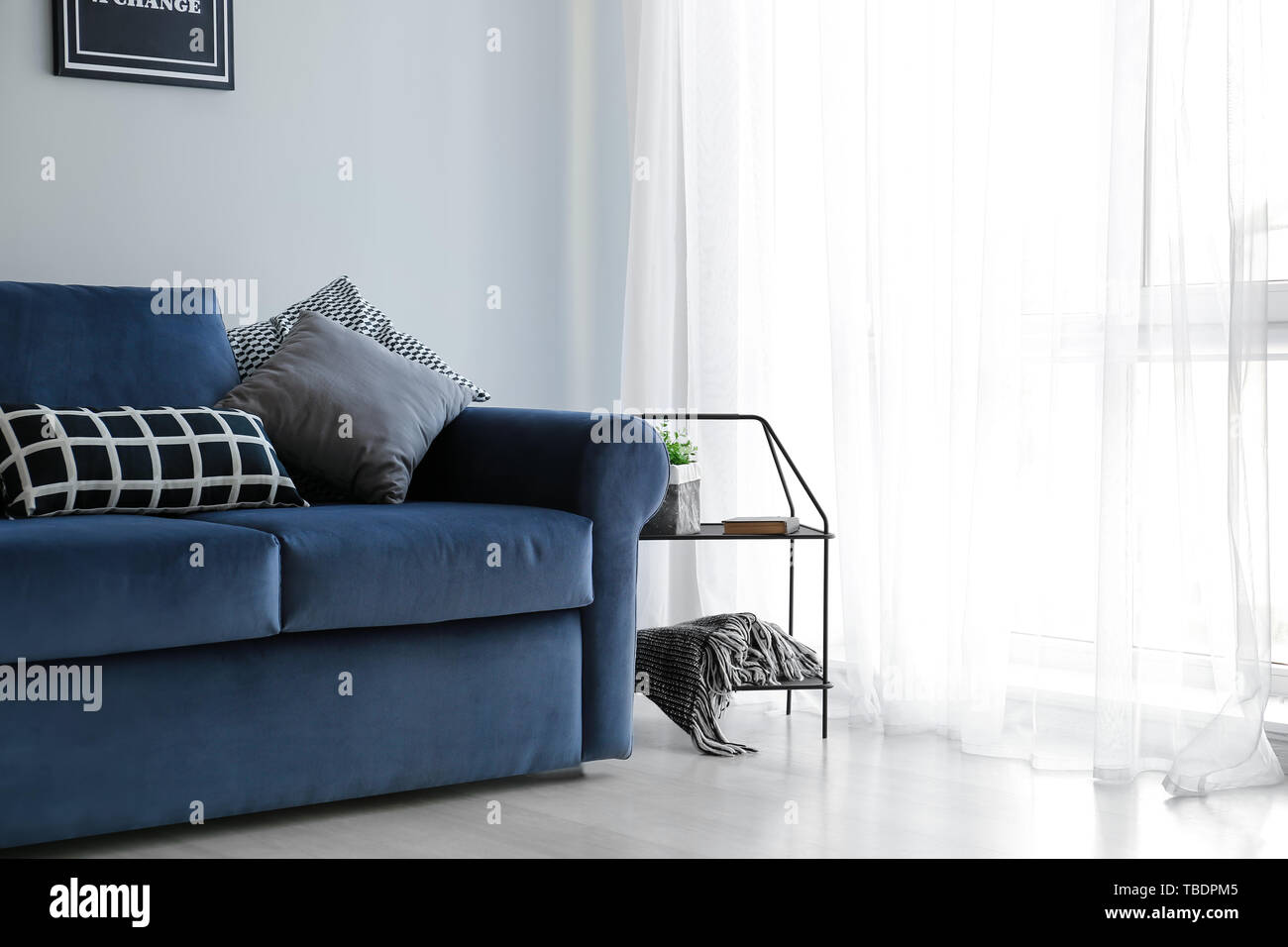 Interior of modern room with comfortable sofa Stock Photo - Alamy