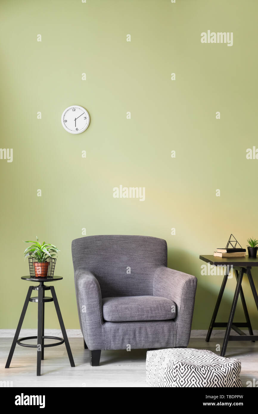 Interior of beautiful modern room with comfortable armchair Stock Photo ...