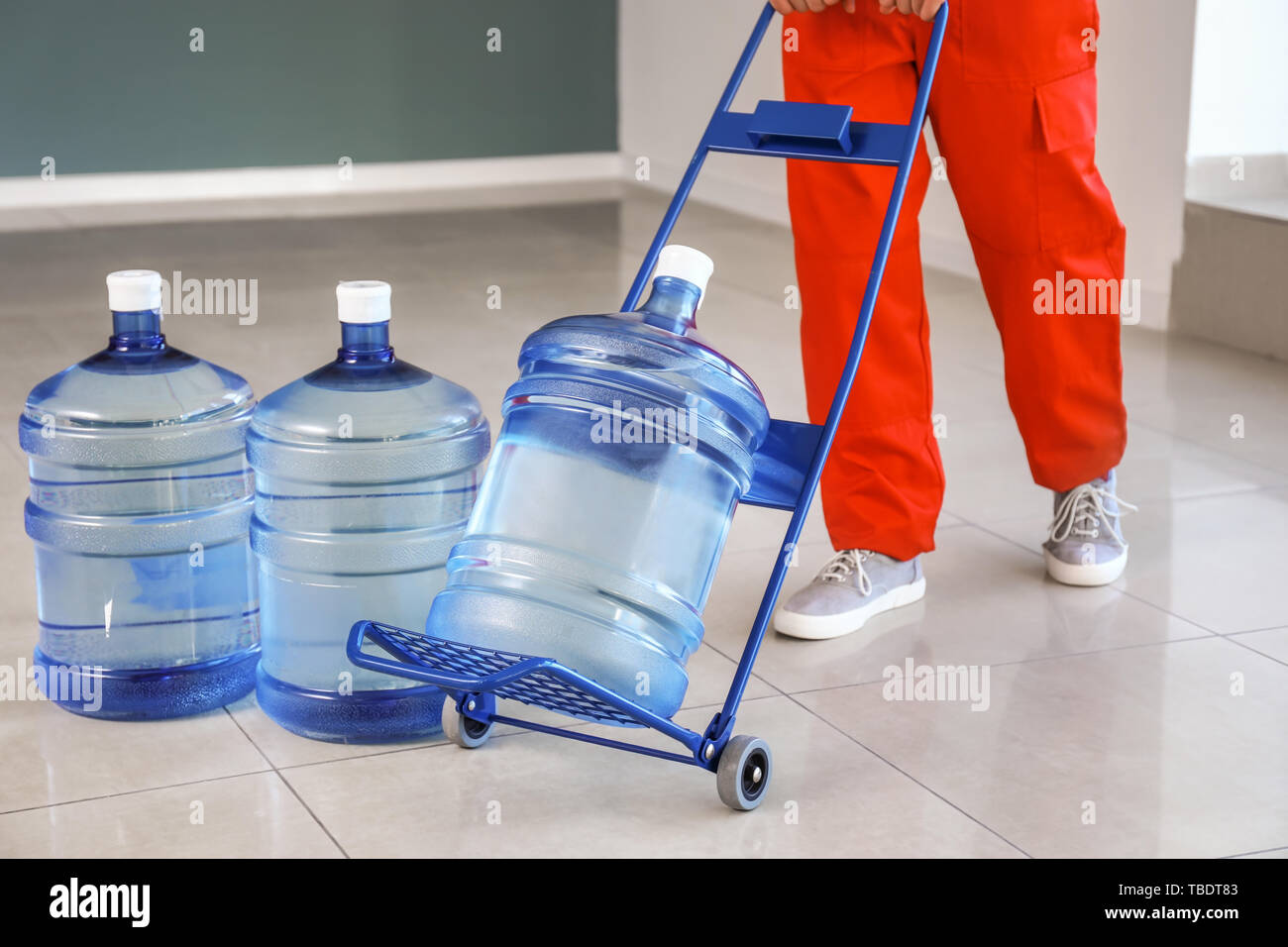 Man hand cart water delivery hi-res stock photography and images - Alamy