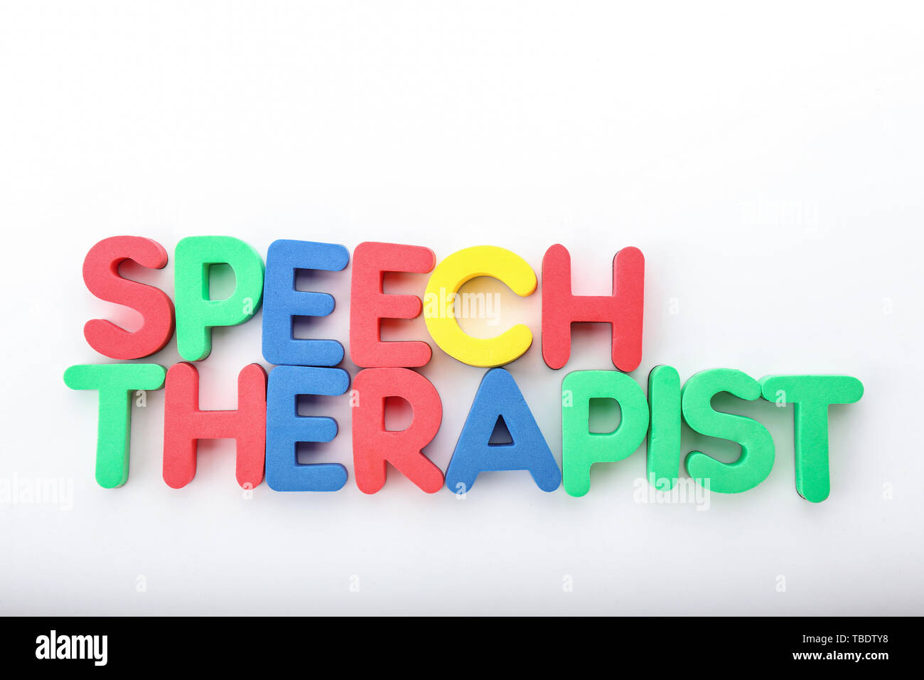 Text SPEECH THERAPIST on white background Stock Photo - Alamy