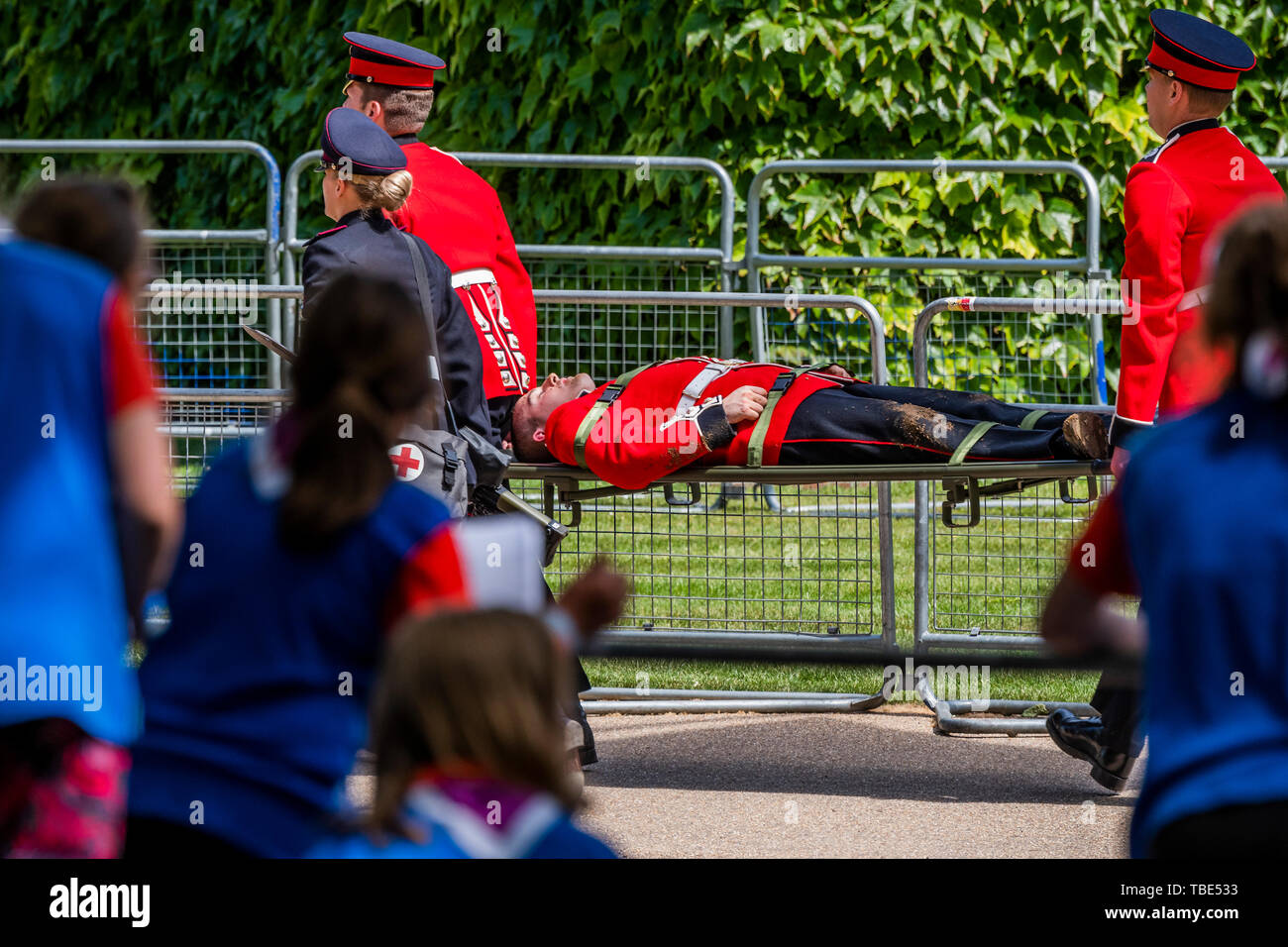 London, UK. 1st June 2019. Two guardsmen faint and are stretchered off ...