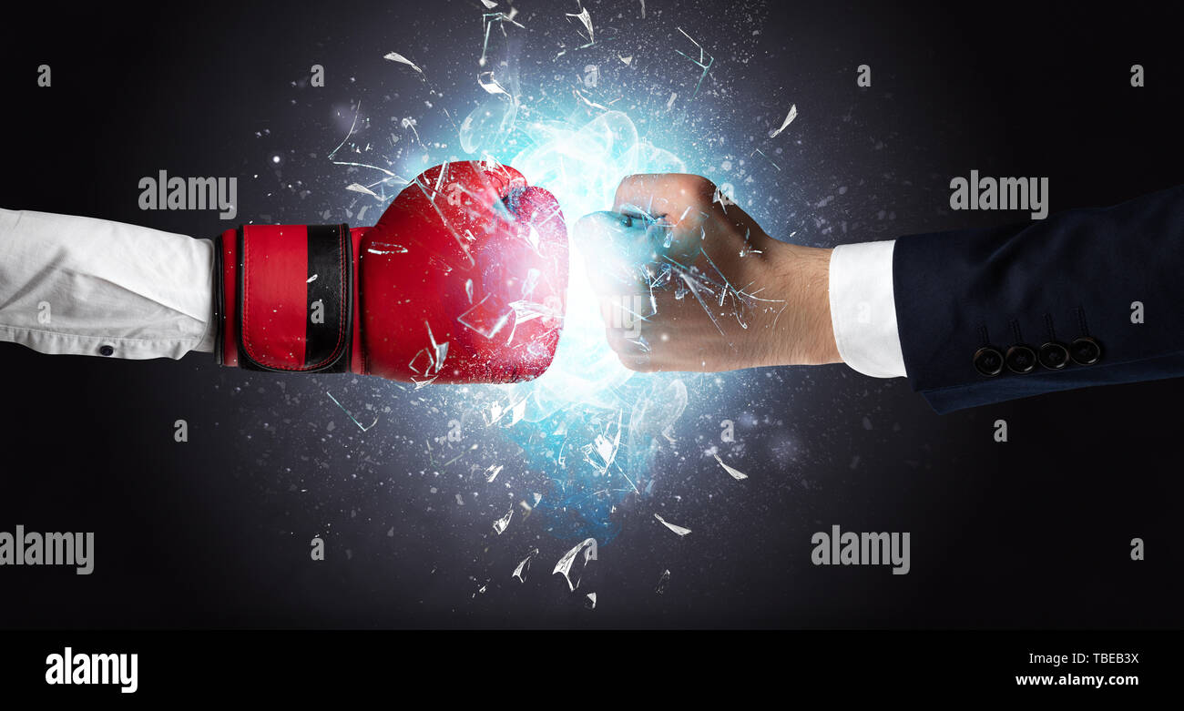 Two hands fighting and breaking glass into small pieces with blue light ...