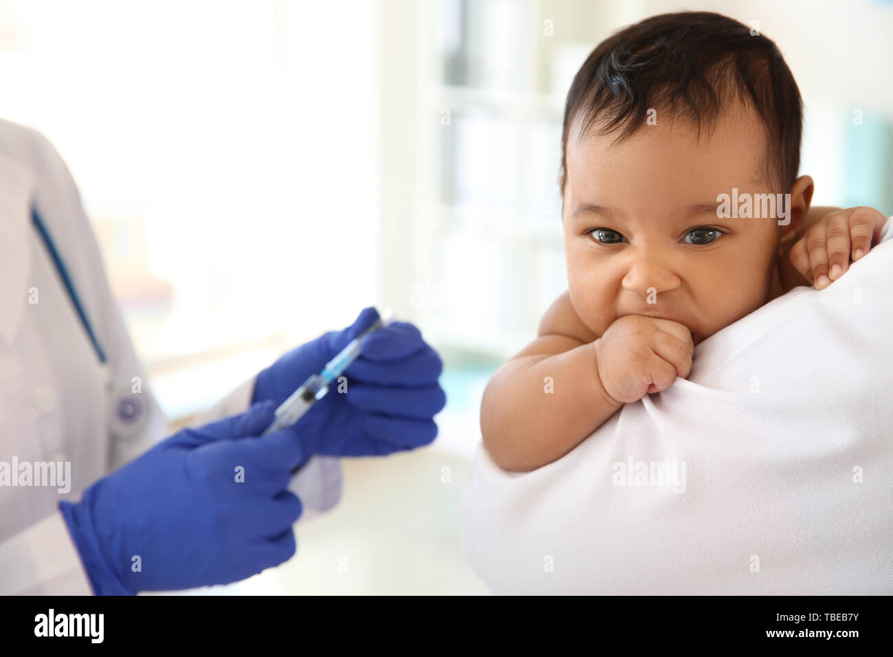 Pediatrician giving baby girl vaccination hi-res stock photography and ...