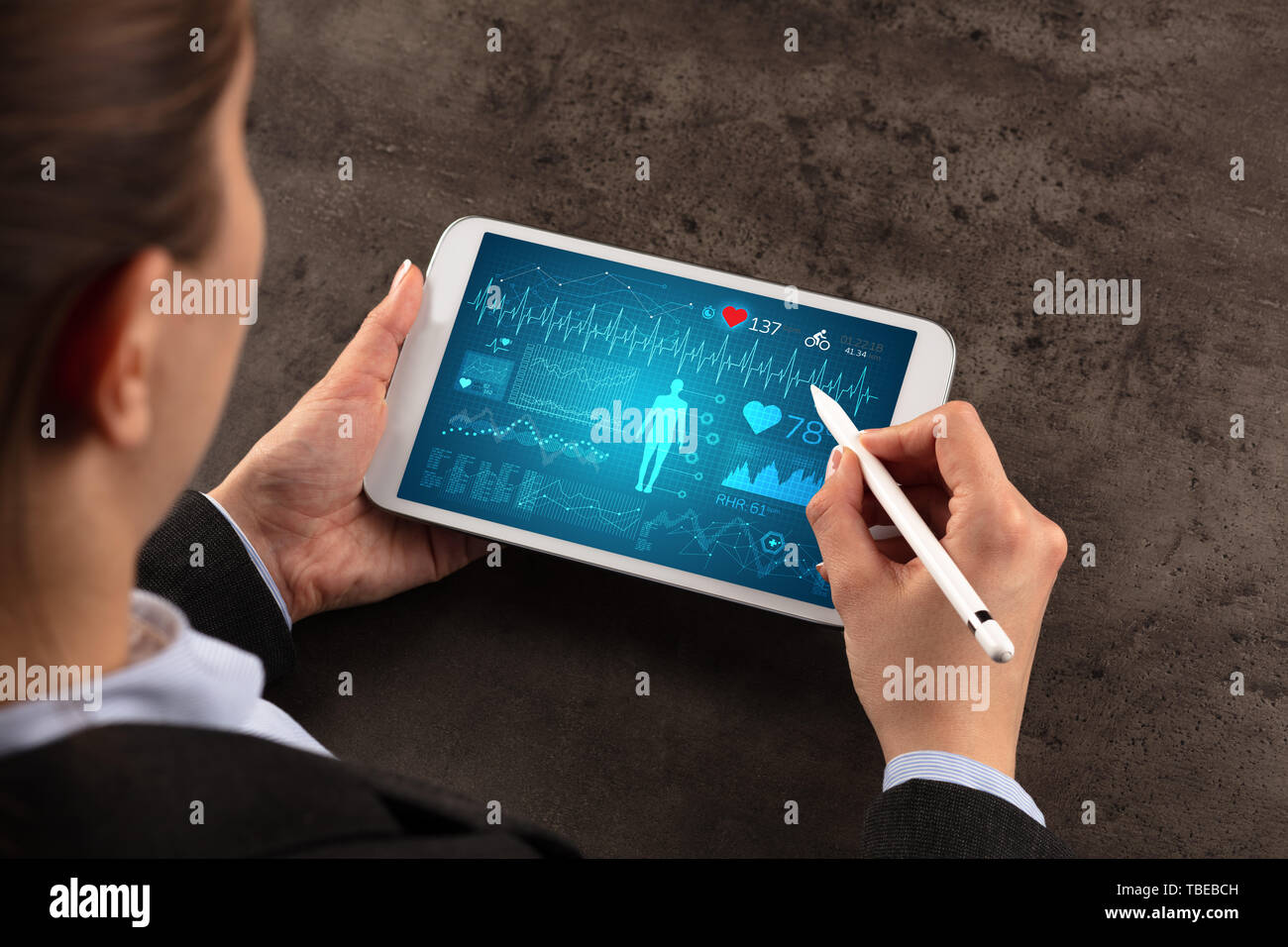 Business woman making healthy analysis on tablet Stock Photo - Alamy