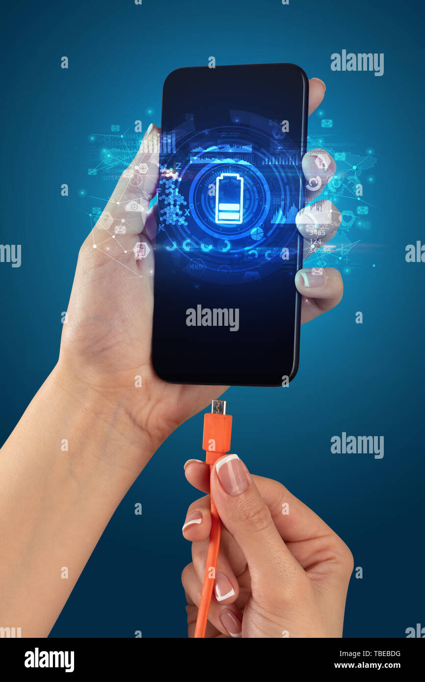 Elegant hand charging smartphone with global report concept Stock Photo ...