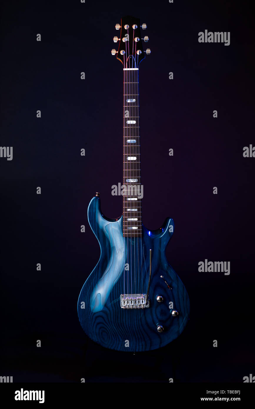 Electric Guitar, dark blue woodgrain, 6 String isolated on black Stock ...
