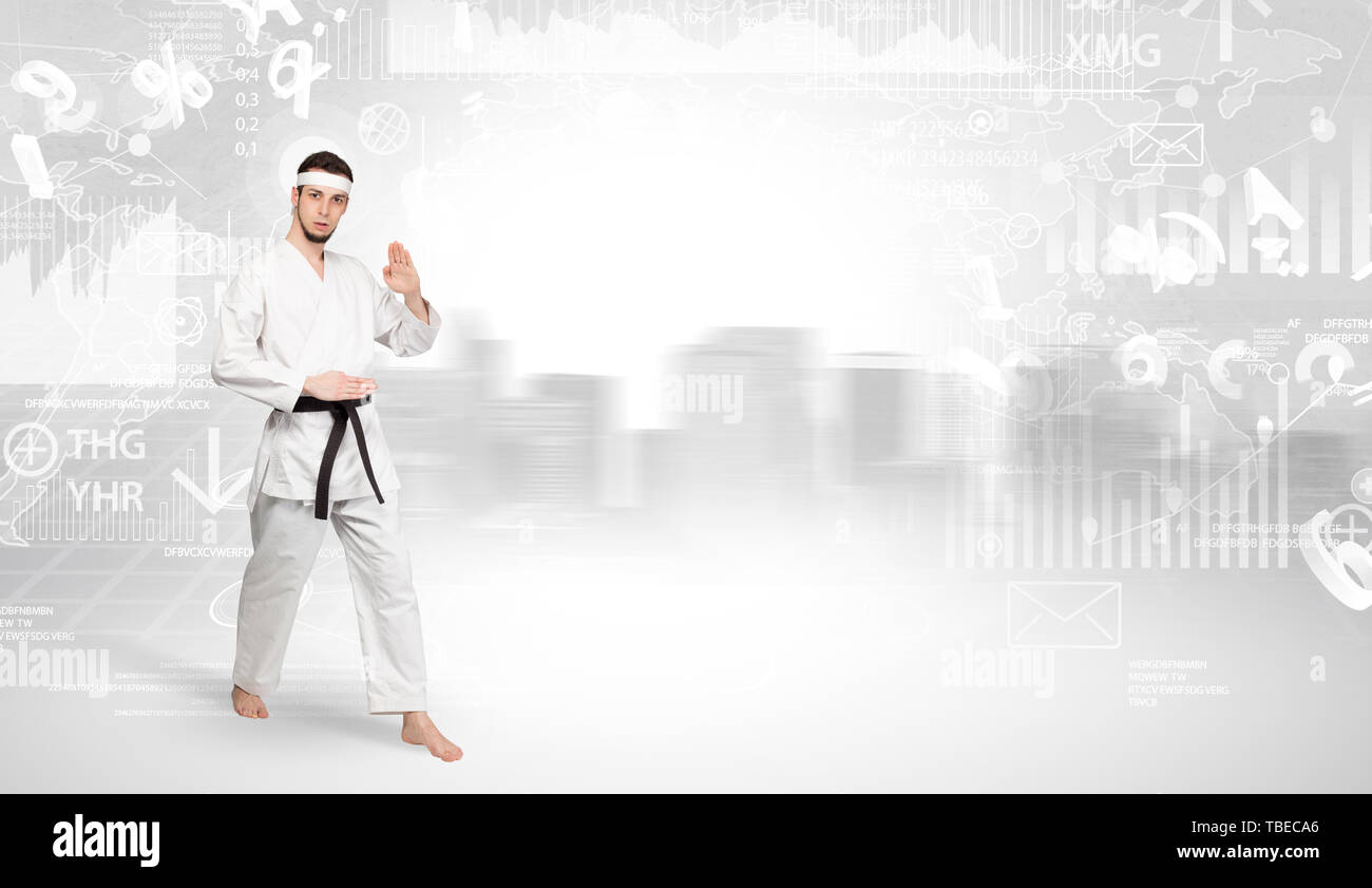 Young karate trainer doing karate tricks on the top of a metropolitan ...