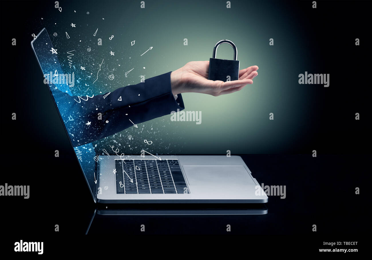 Hand with lock coming out of a laptop with sparkling effects Stock ...