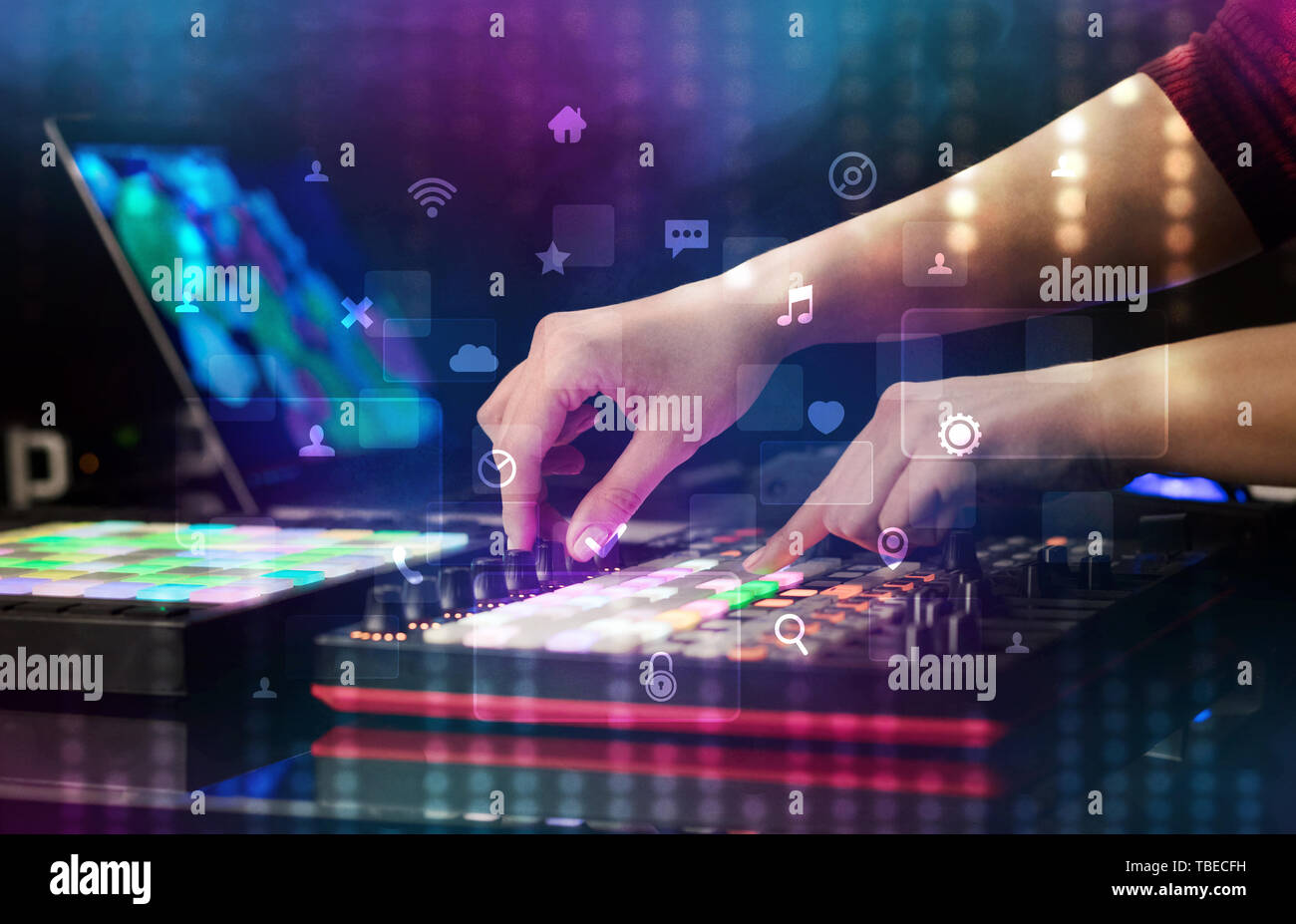 Hand mixing music on dj controller with social media concept icons ...