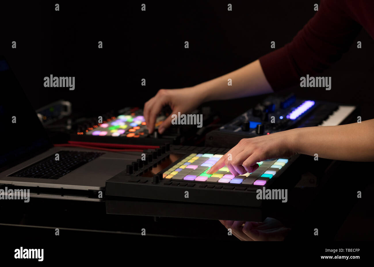 Dj hand remixing music on midi controller Stock Photo - Alamy