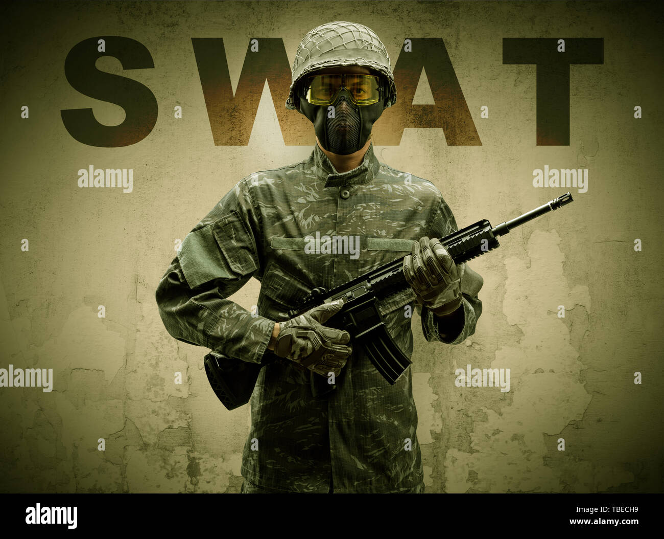 Uniformed armed soldier with damaged wall background Stock Photo - Alamy