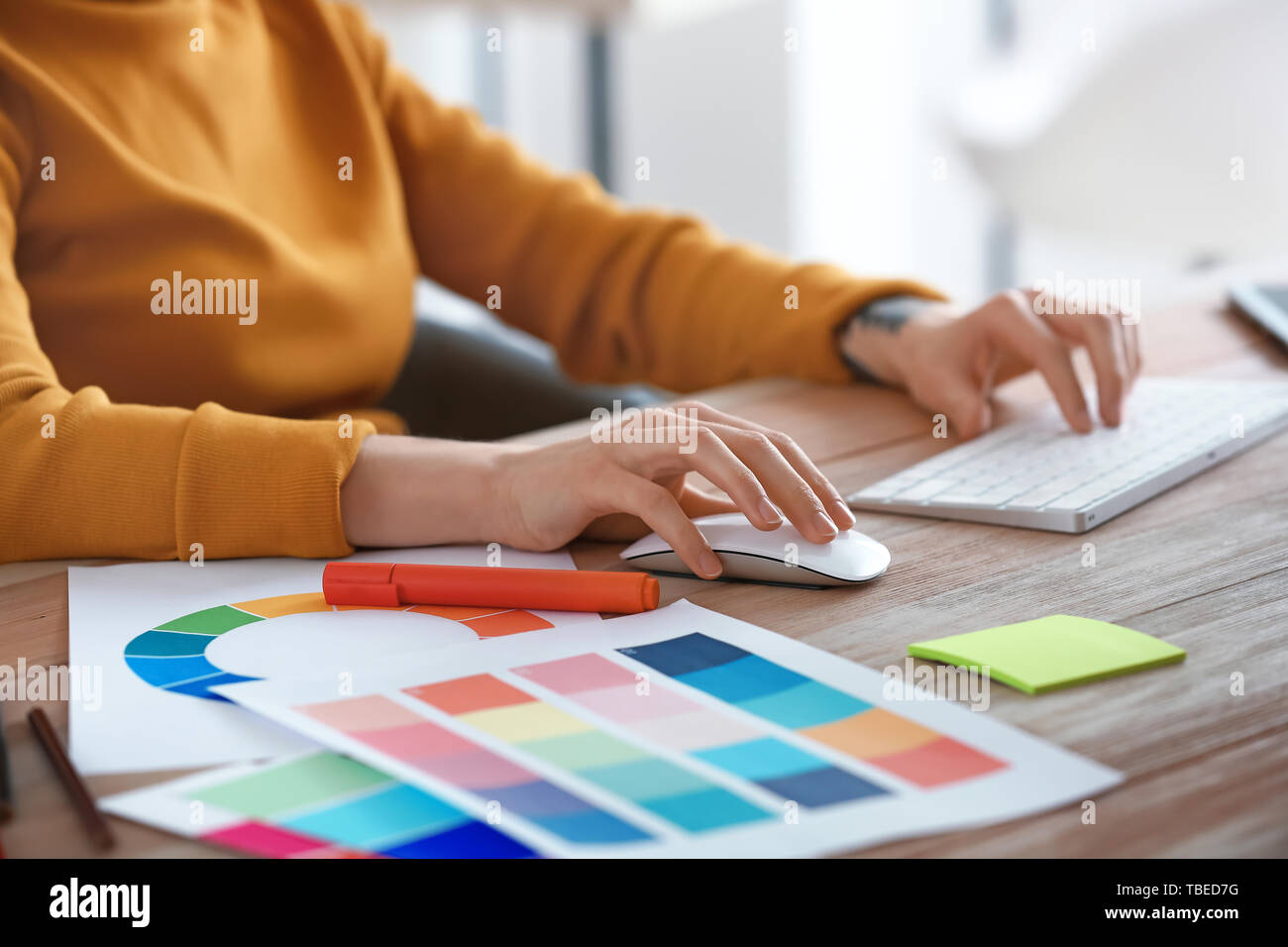 Female designer working in office Stock Photo - Alamy