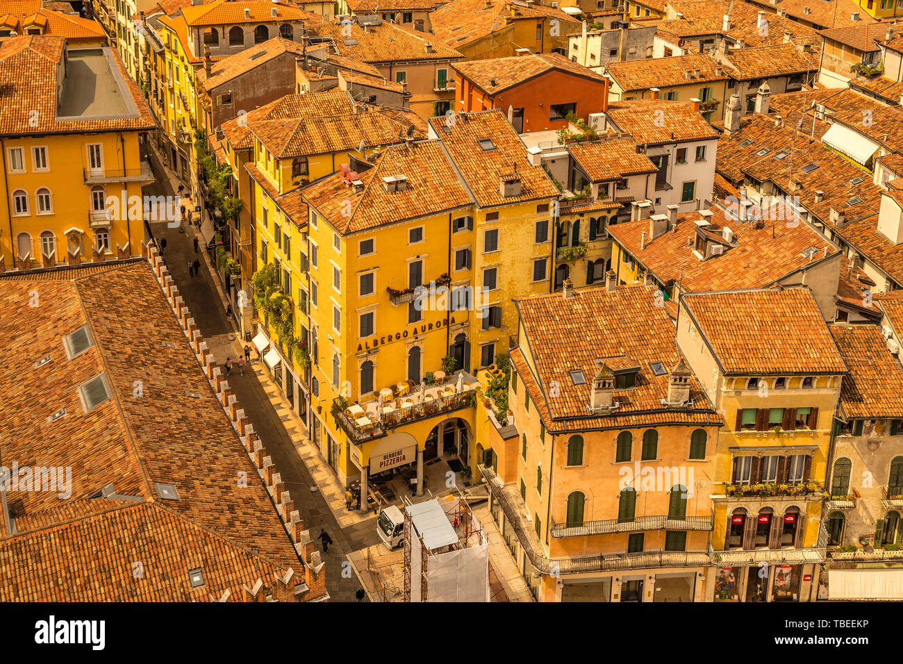 VERONA (VR), ITALY - MAY 10, 2019: sun is enlightening the roofs ot the ...