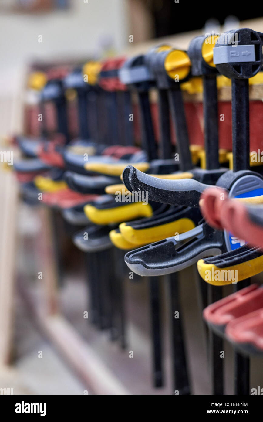 Carpenter clamps in a woodworking workshop Stock Photo - Alamy