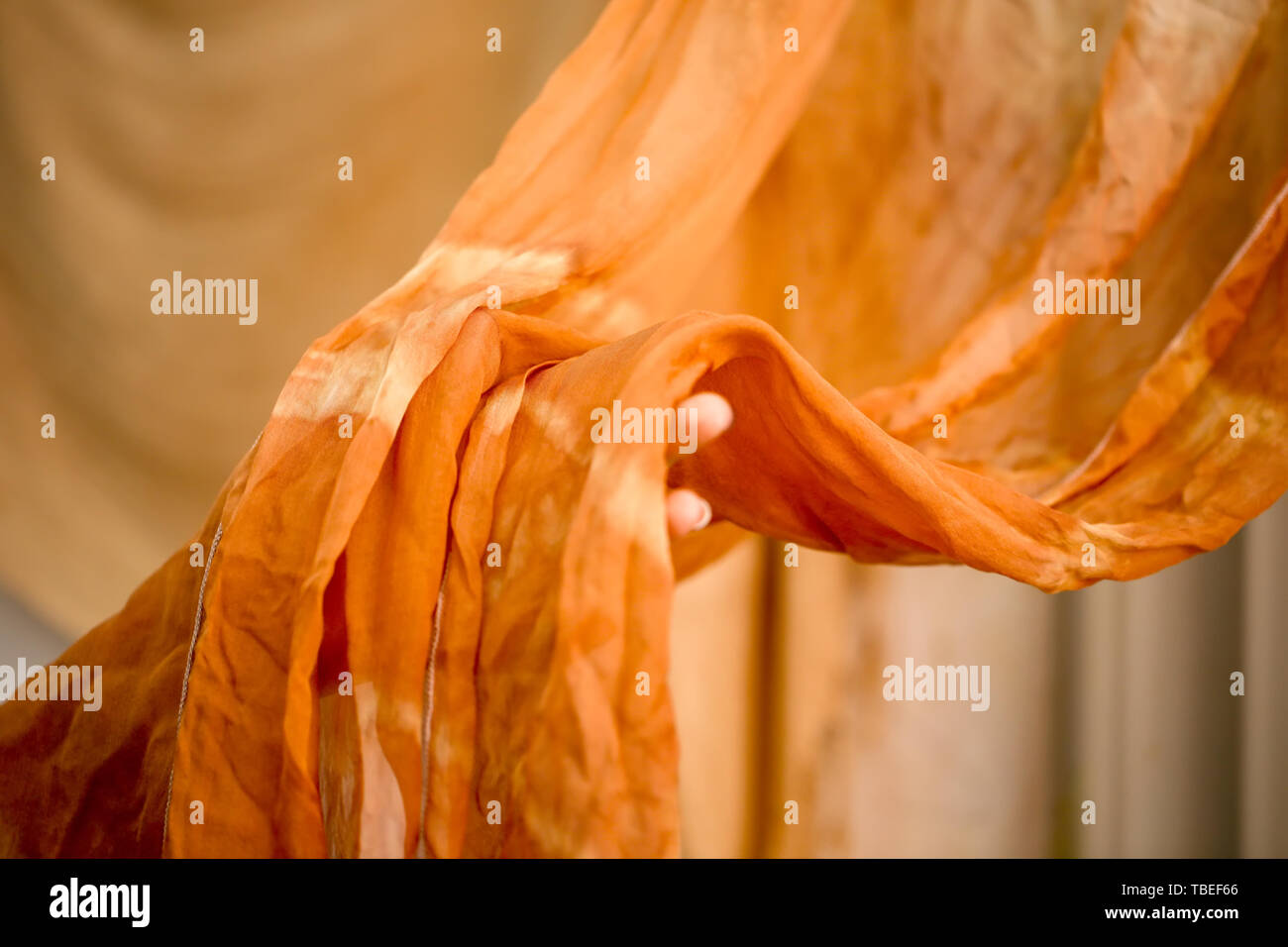 Hand stroking soft silk and fabric Stock Photo - Alamy