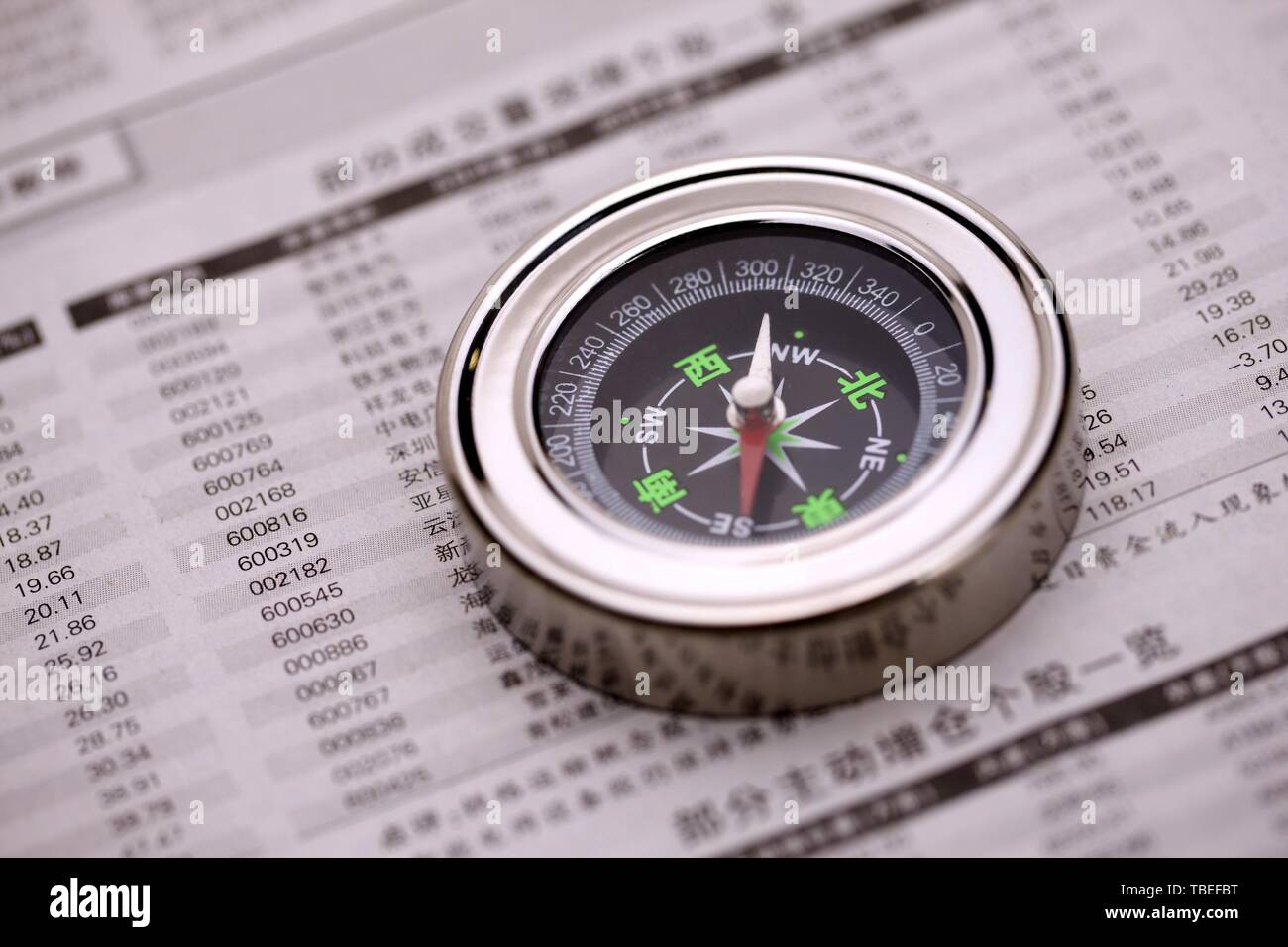 Newspaper compass hi-res stock photography and images - Alamy