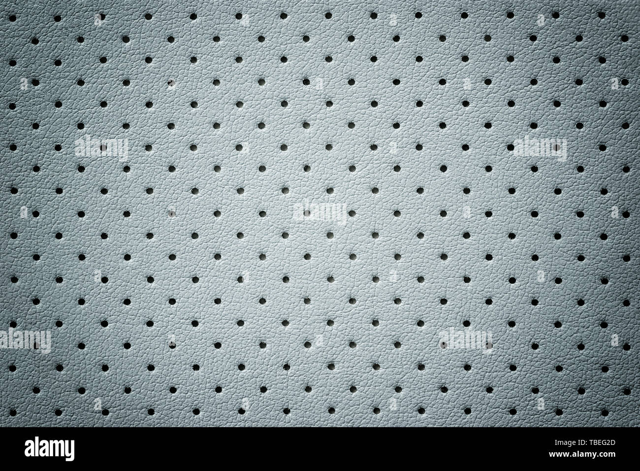 Perforated light blue leather texture background with gradient frame ...
