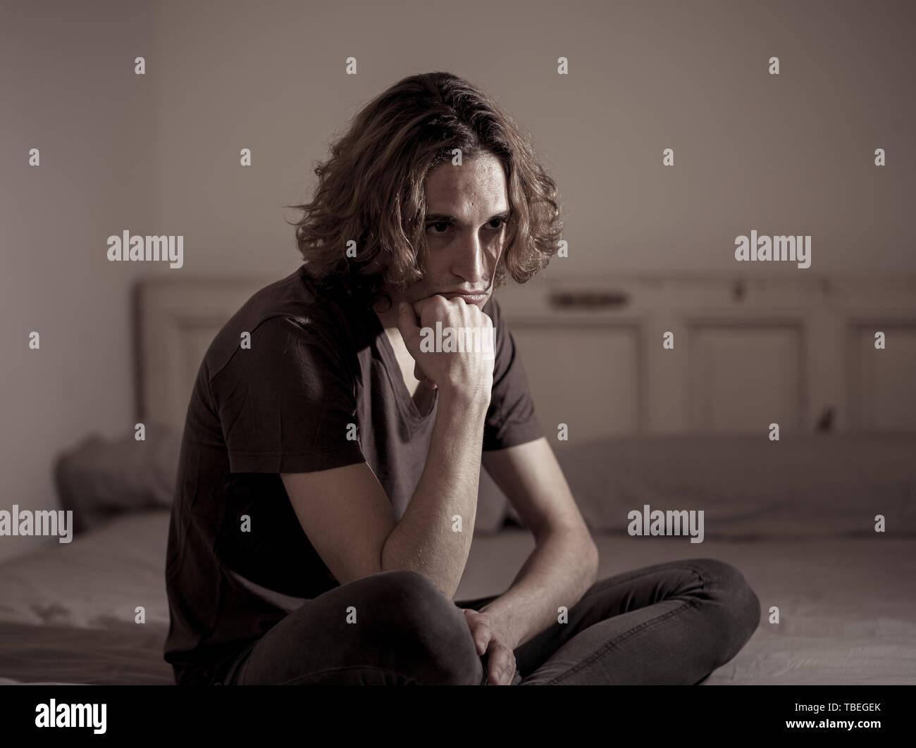 Devastated millennial man crying sad feeling hurt and hopeless ...