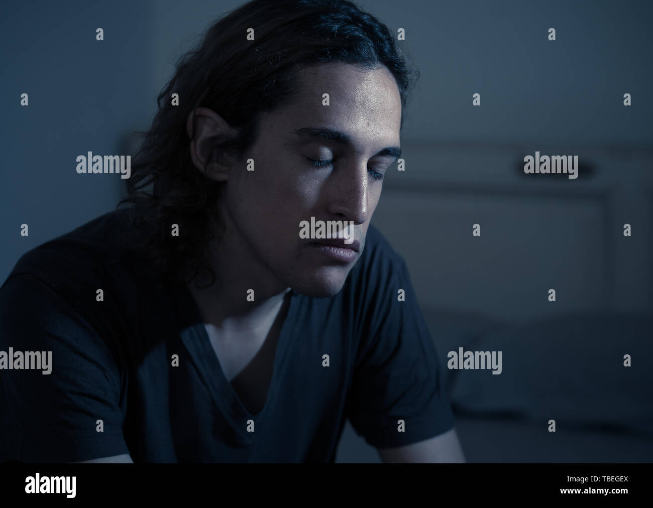 Devastated millennial man crying sad feeling hurt and hopeless ...