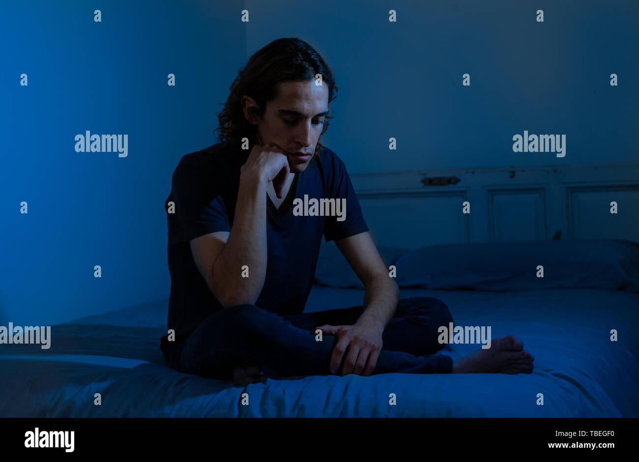 Devastated millennial man crying sad feeling hurt and hopeless ...