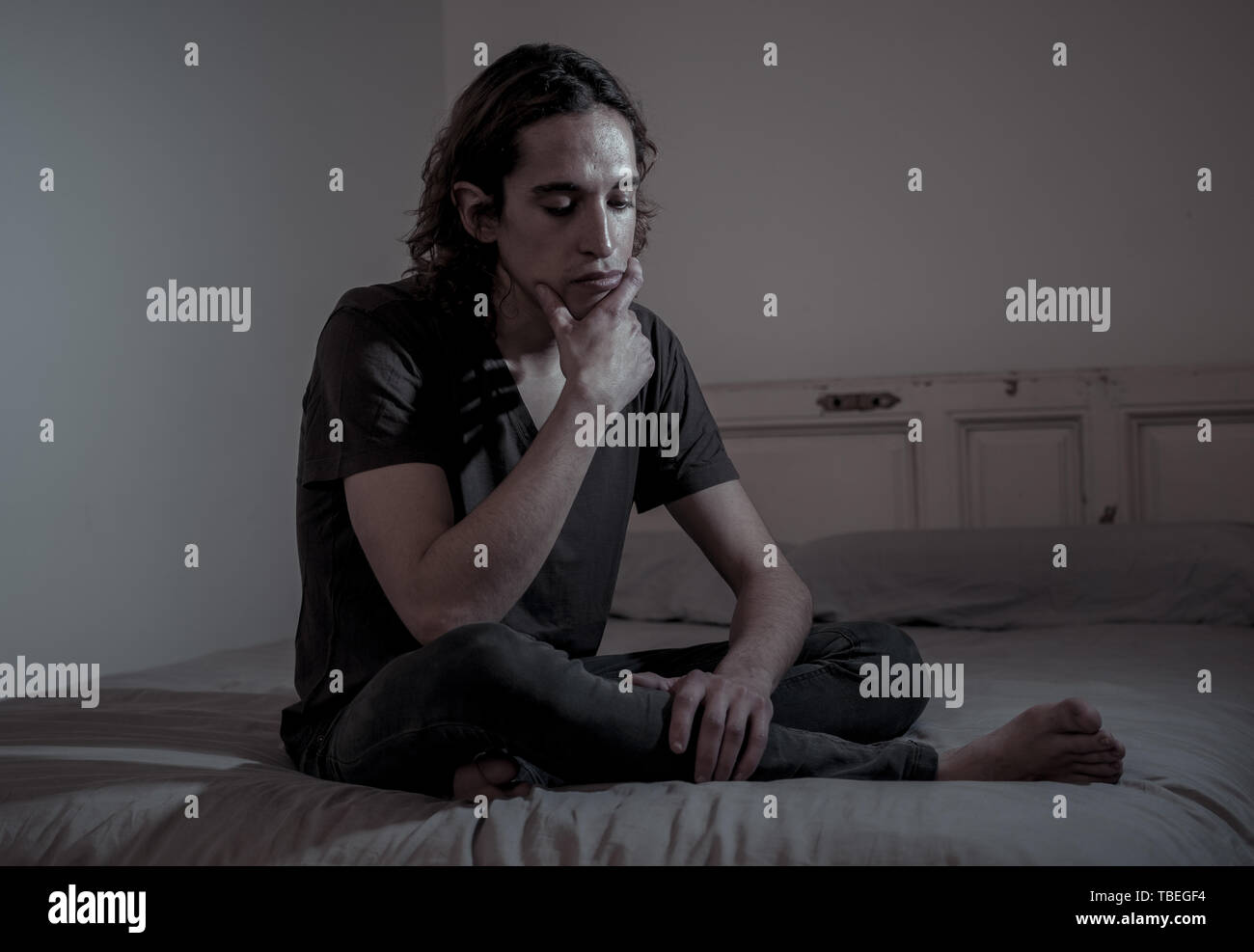 Devastated millennial man crying sad feeling hurt and hopeless ...