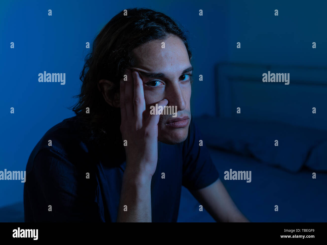 Devastated millennial man crying sad feeling hurt and hopeless ...