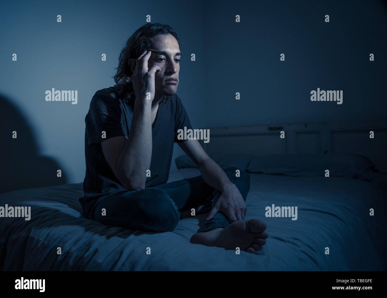 Devastated millennial man crying sad feeling hurt and hopeless ...