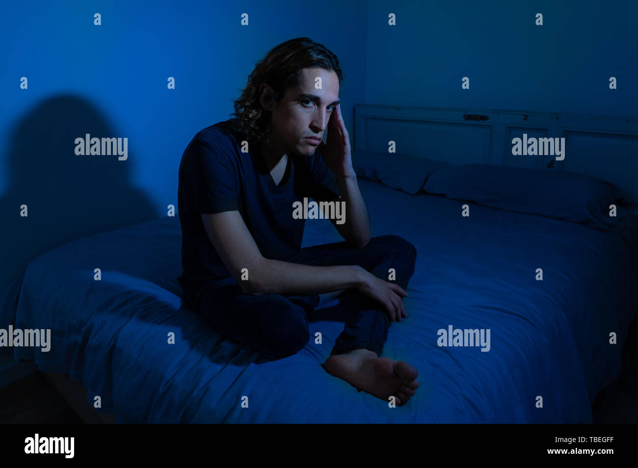 Devastated millennial man crying sad feeling hurt and hopeless ...