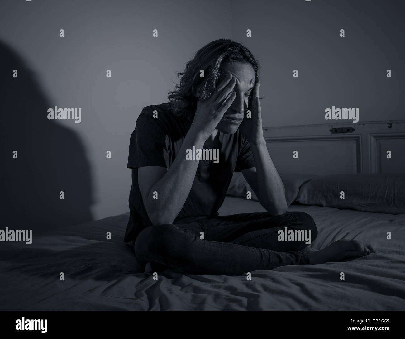 Devastated millennial man crying sad feeling hurt and hopeless ...