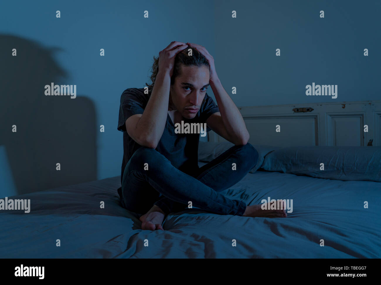 Devastated millennial man crying sad feeling hurt and hopeless ...