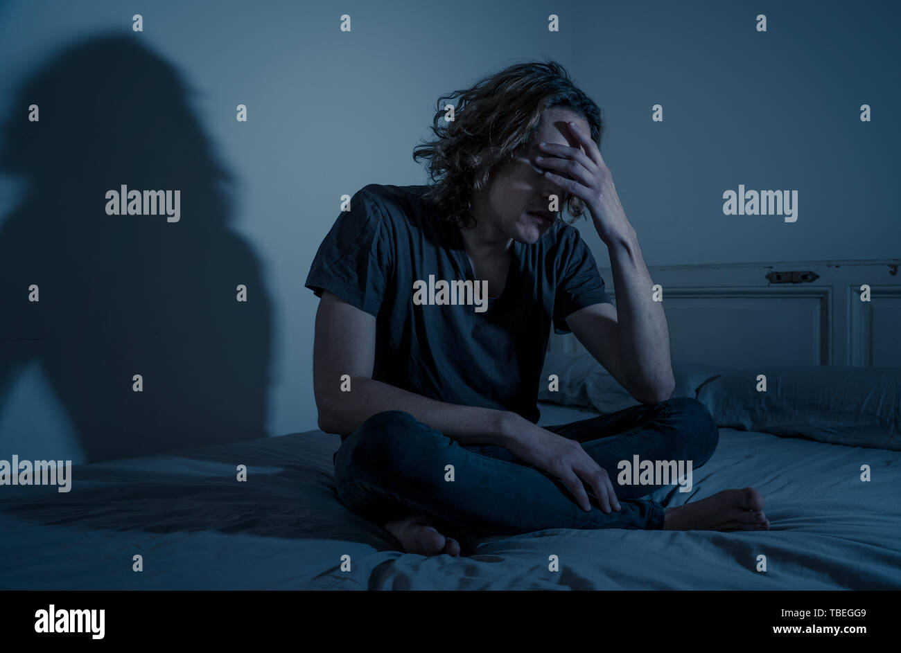 Devastated millennial man crying sad feeling hurt and hopeless ...