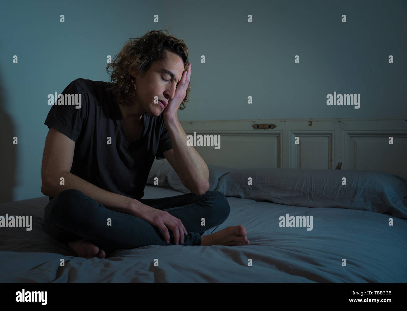 Devastated millennial man crying sad feeling hurt and hopeless ...