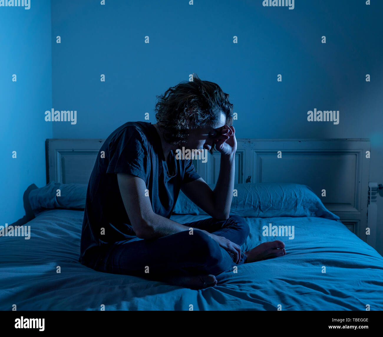 Devastated millennial man crying sad feeling hurt and hopeless ...