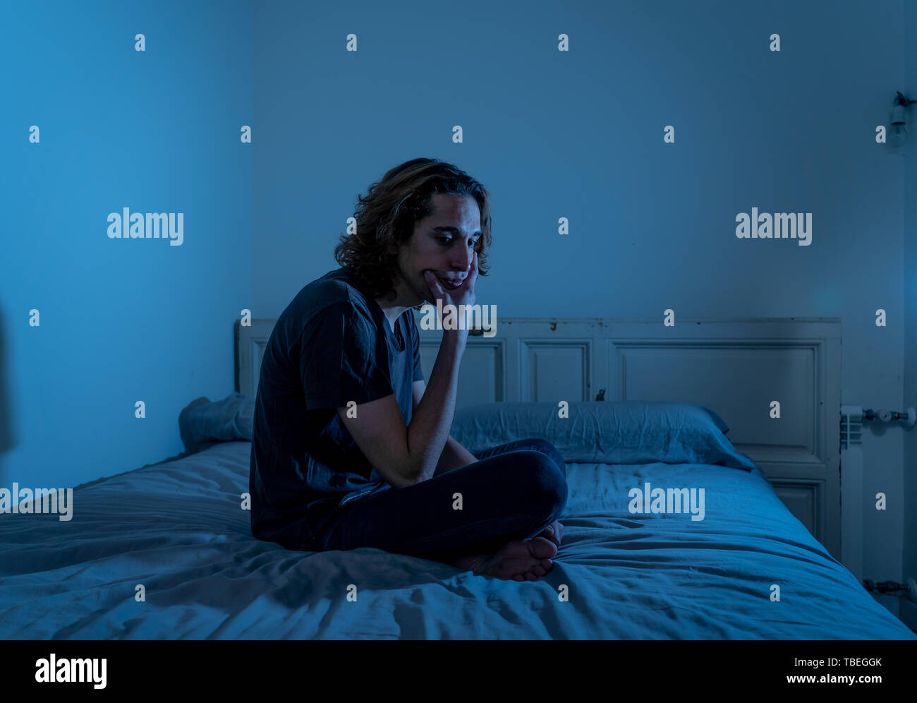 Devastated millennial man crying sad feeling hurt and hopeless ...